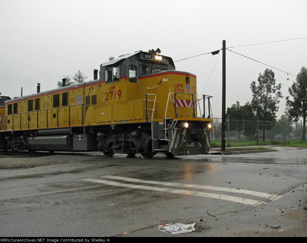 UPY switchers leaving Grove Lumber Yard on a wet, rainy January day